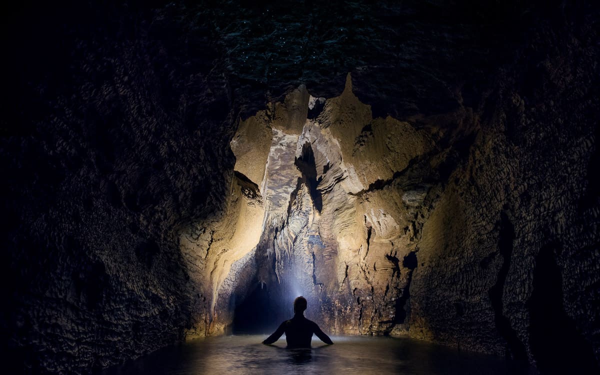 Into the Abyss: Black Water Rafting at the Waitomo Caves - Adventures ...